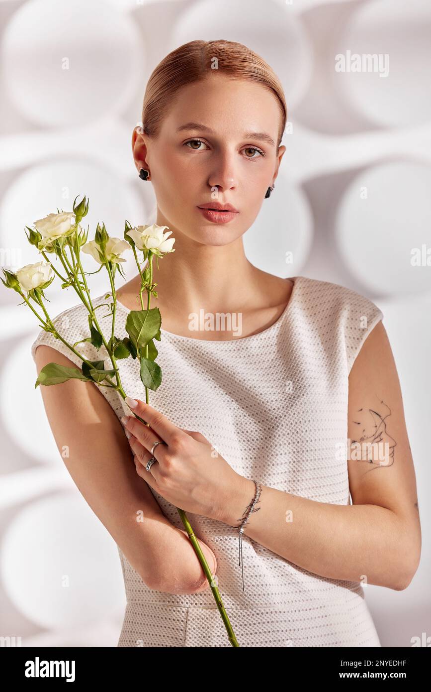 Portrait of a beautiful young disabled woman, born without an arm ...