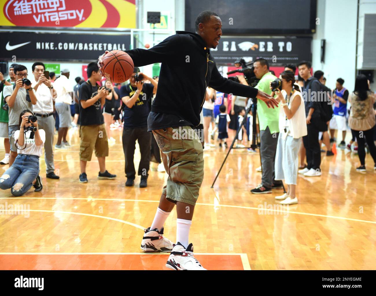 NBA star Paul Pierce shows off his basketball skills during a ...