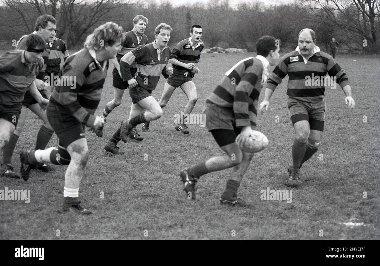 1980s, historical, amateur rugby union, wing back with balll in hand ...
