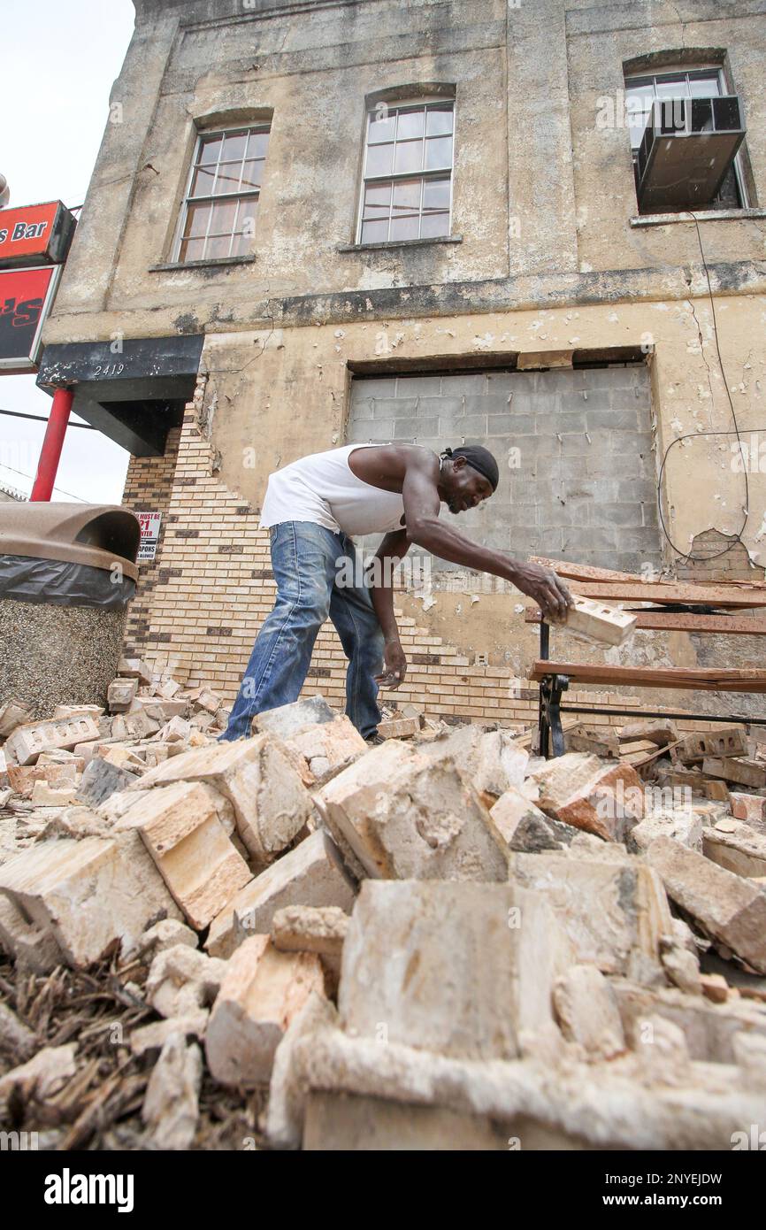 Billy Jones with Willie Curtis Masonry salvages bricks Monday, Aug. 7 ...