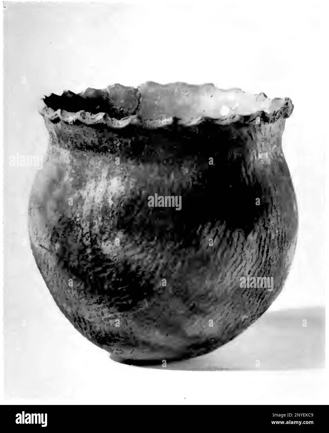 Pottery vessel with scalloped rim Stock Photo - Alamy