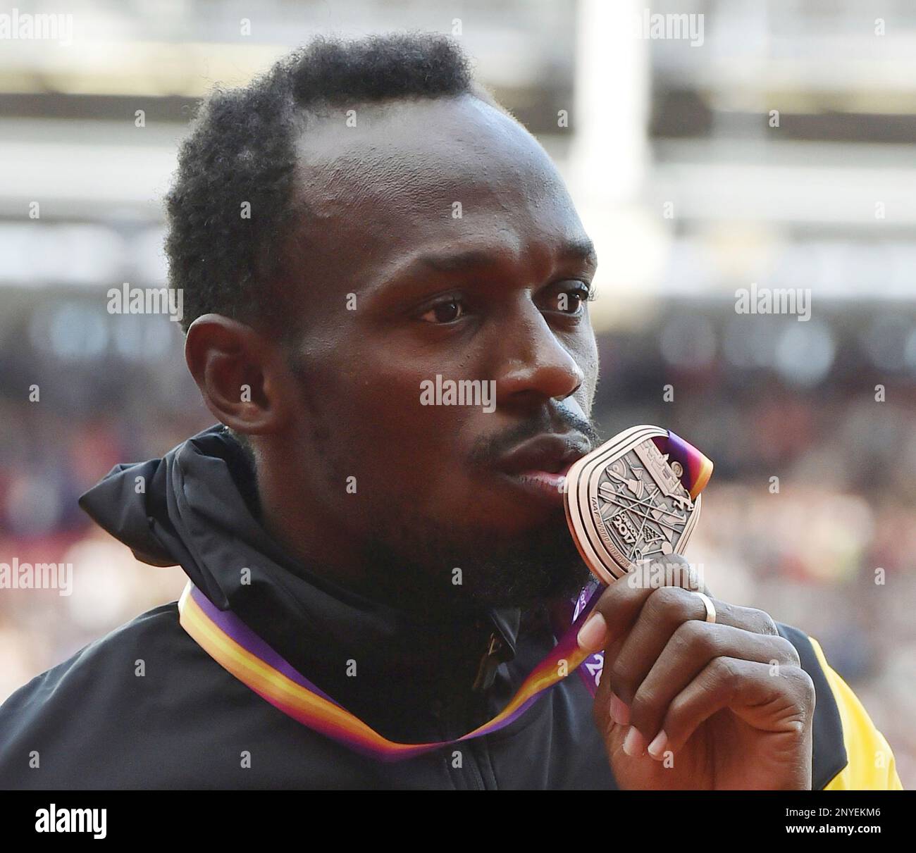 Jamaica's Usain Bolt, 3rd, kisses his medal during the medal ceremony ...