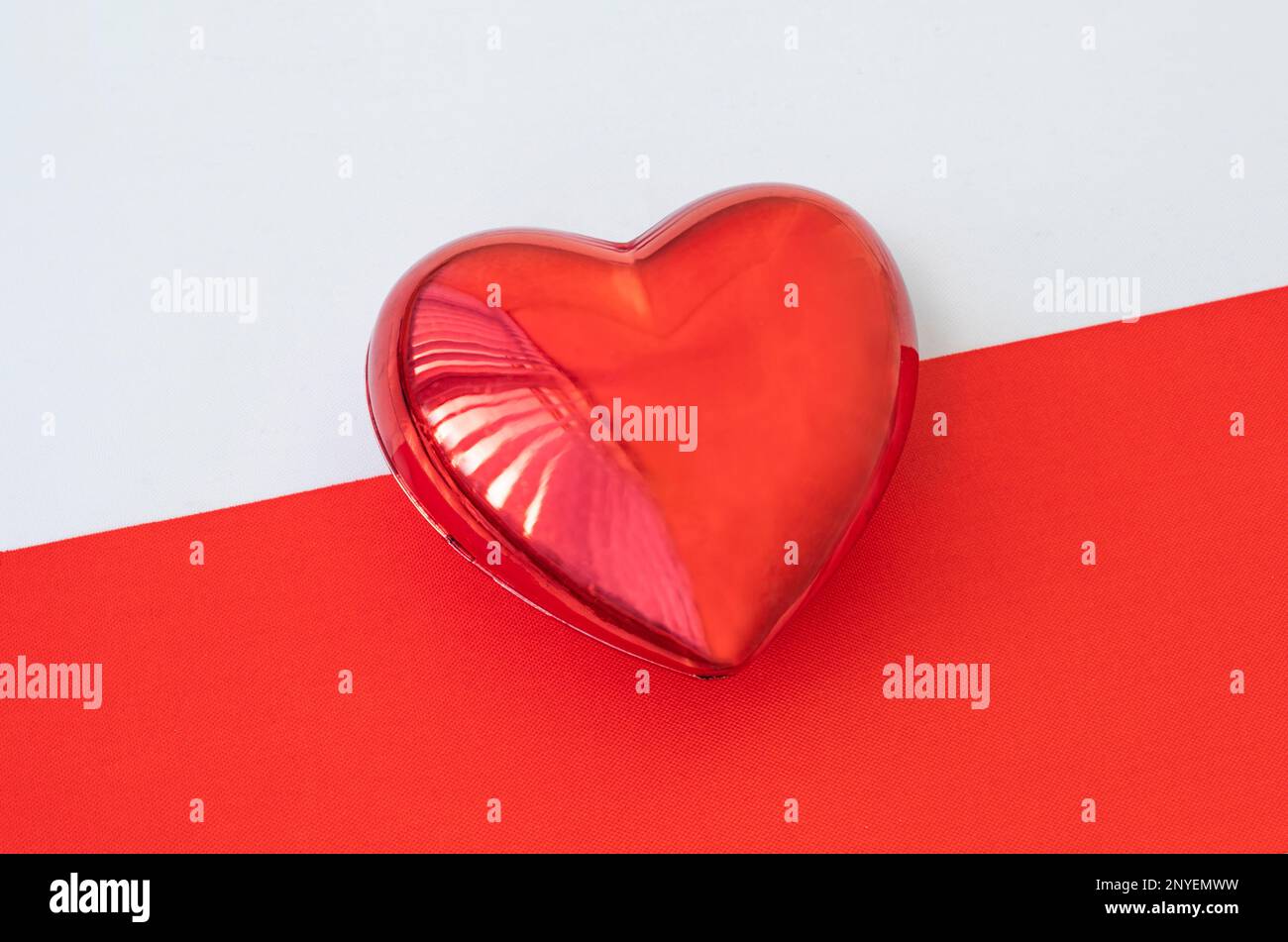 The red heart is on the flag of poland . The concept of patriotic ...