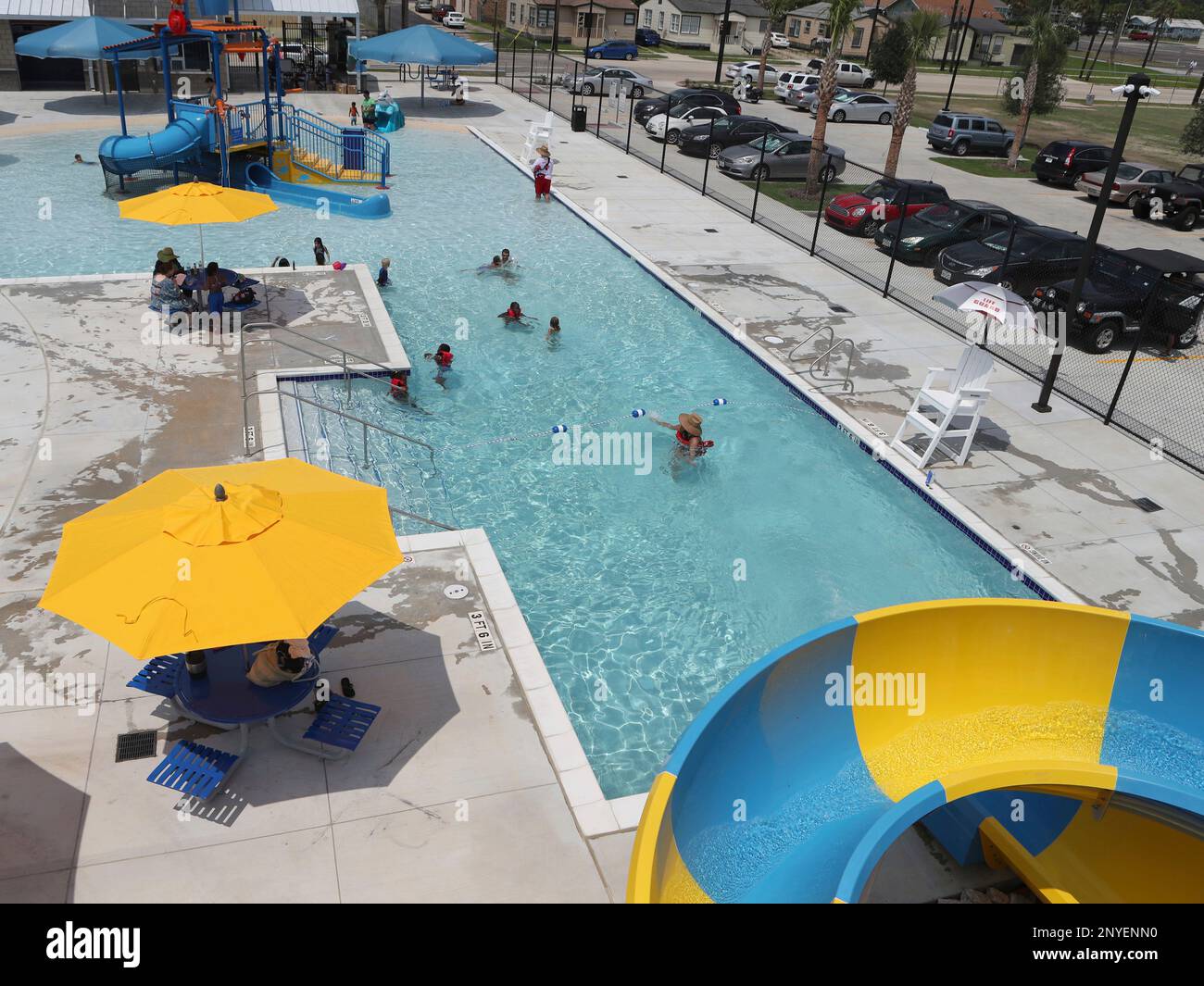 In this Friday, Aug. 4, 2017 photo, Galveston residents swim and play ...
