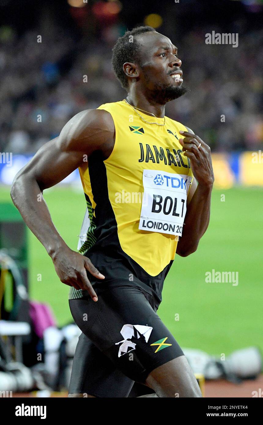 Jamaica's Usain Bolt looks stern after crossing the finish line in the ...