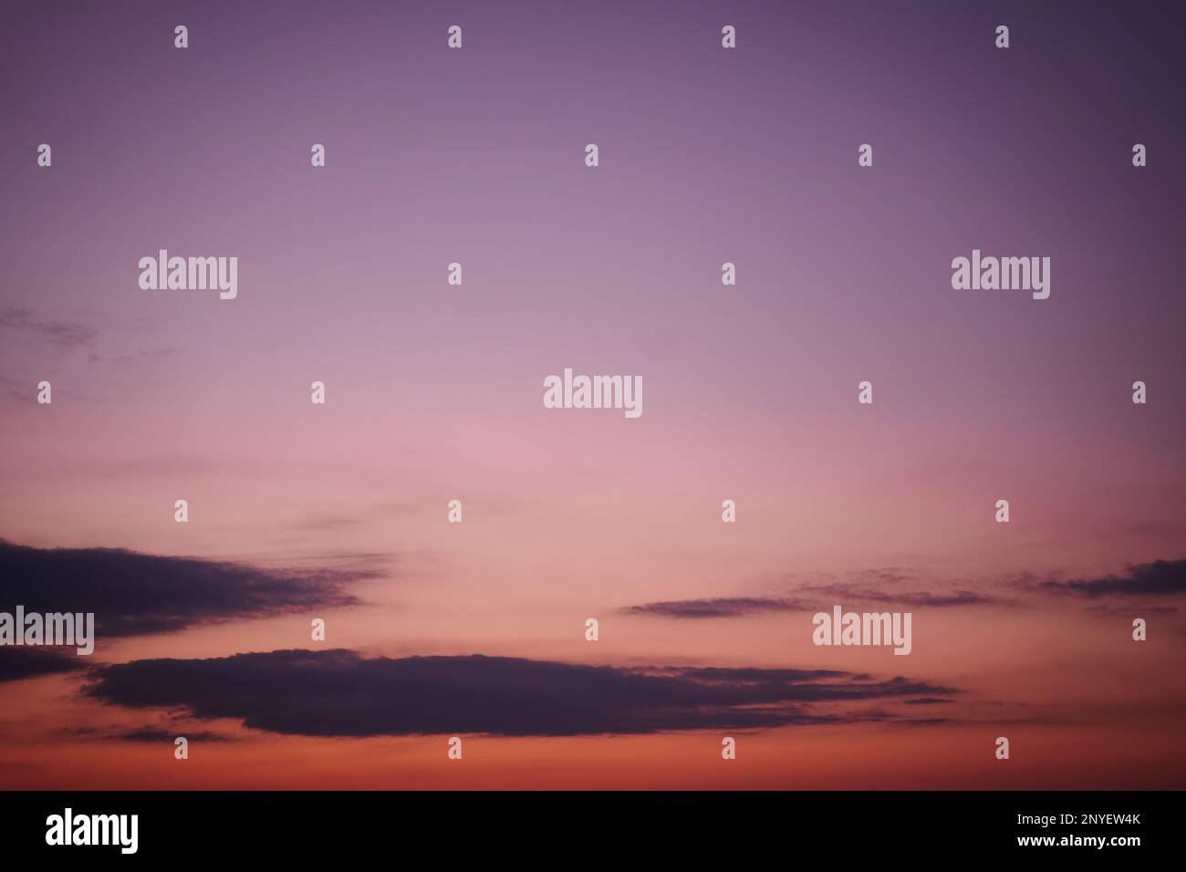 Orange and pink dramatic sunset sky with clouds. Photo background Stock ...