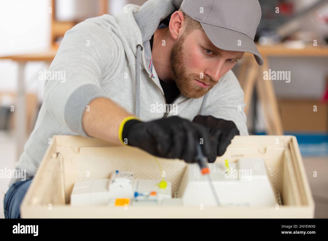 Male tech repairs electronic equipment hi-res stock photography and ...