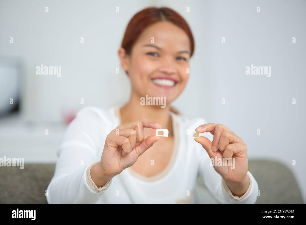 female showing sim card Stock Photo - Alamy
