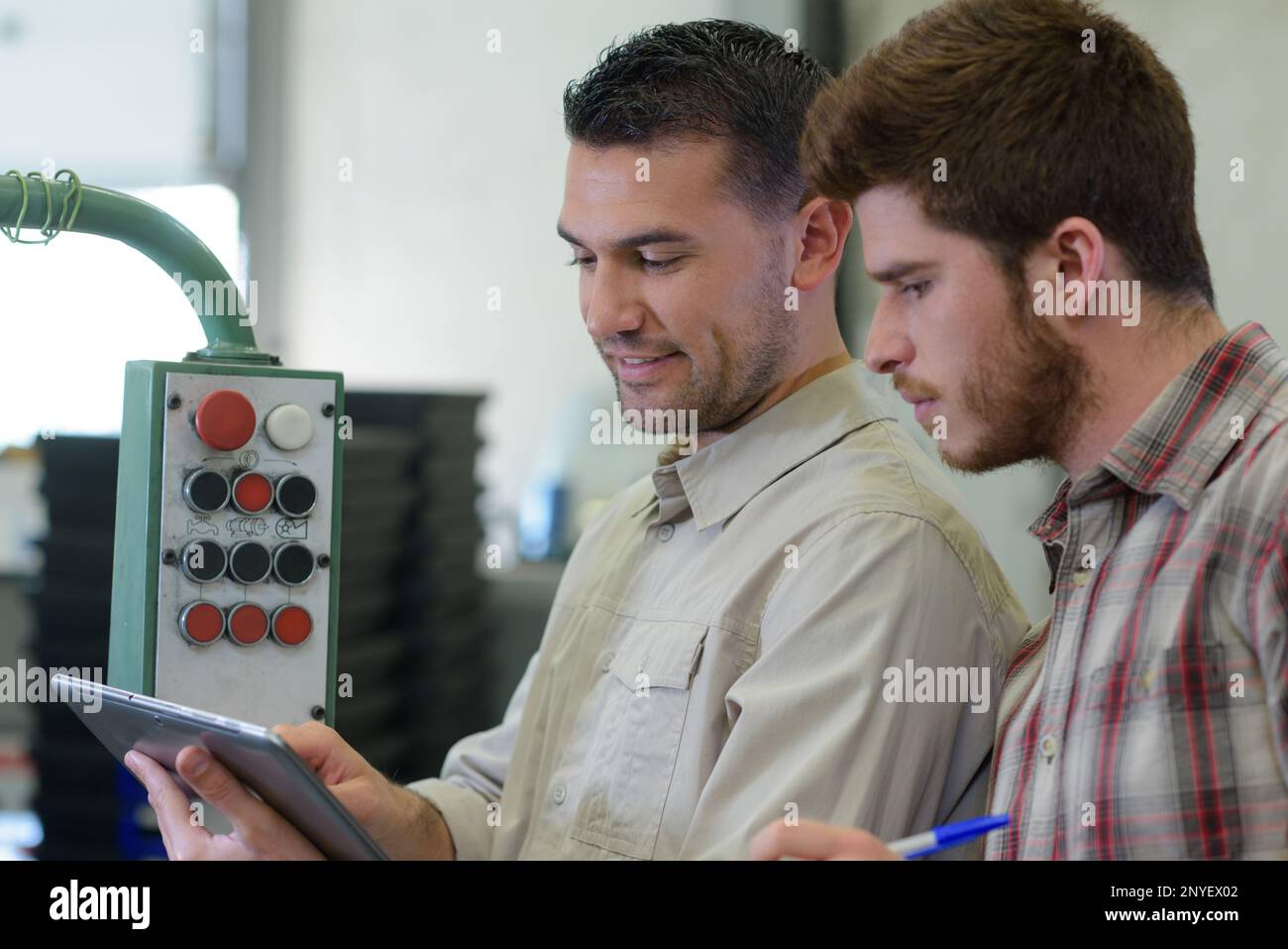 an engineer operating a machine Stock Photo - Alamy