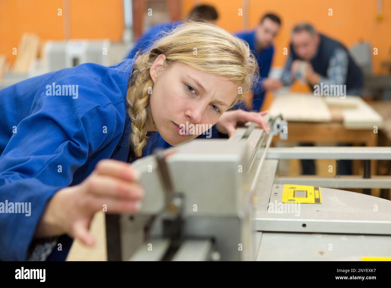 Woman adjusting equipment in hi-res stock photography and images - Alamy