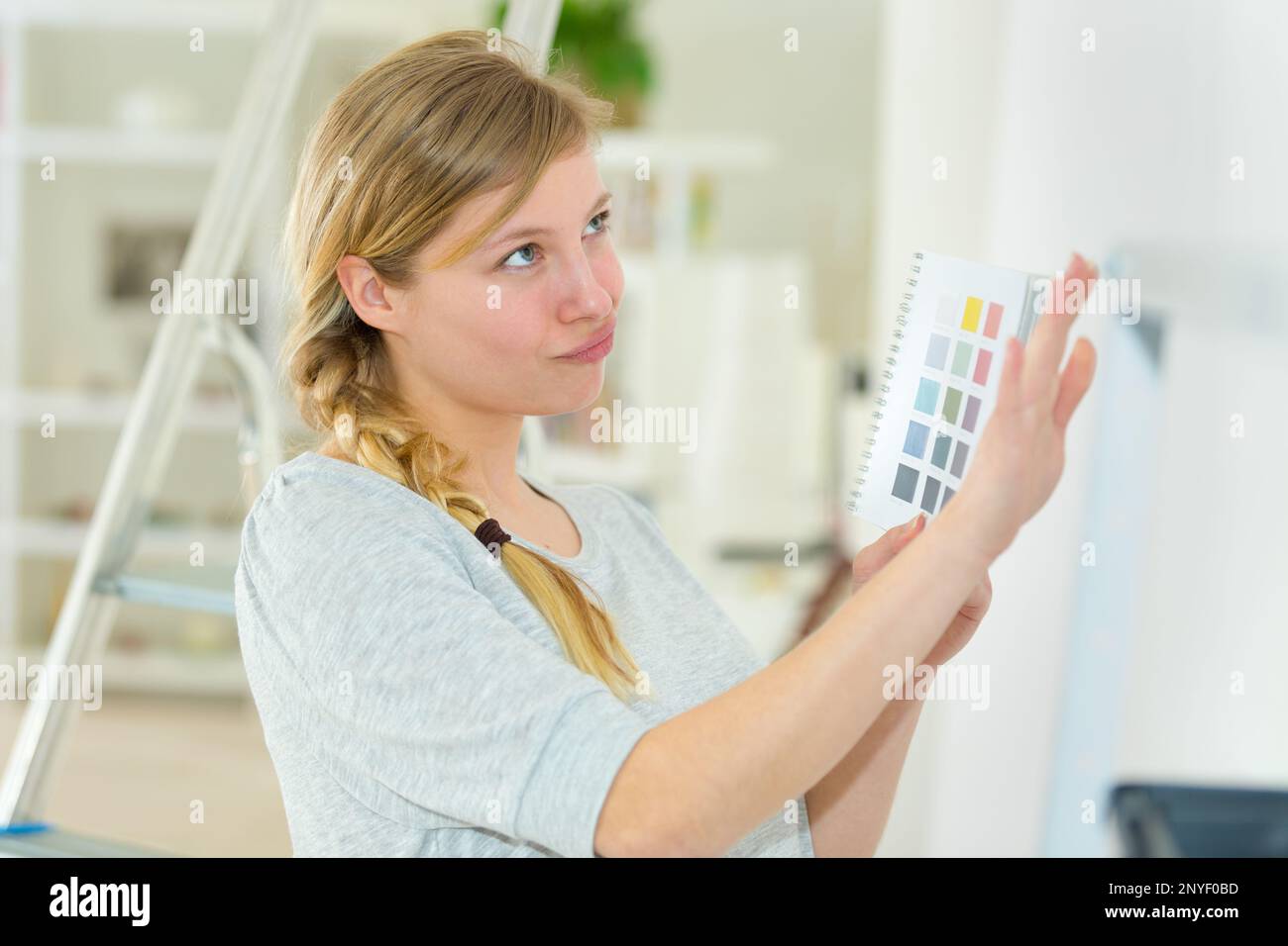 young designer choosing between color swatches Stock Photo - Alamy