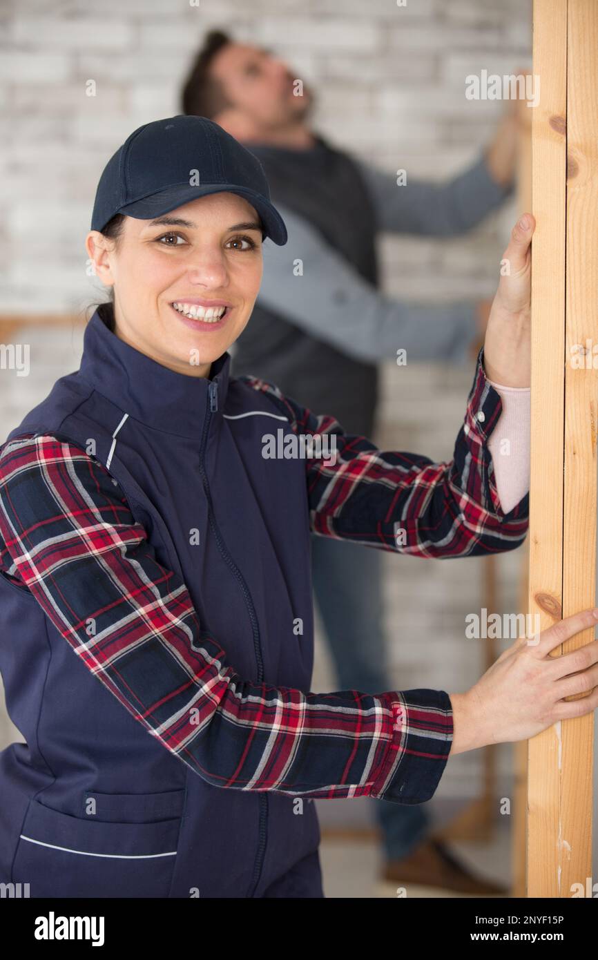 carpenter woman smiling at the camera Stock Photo - Alamy