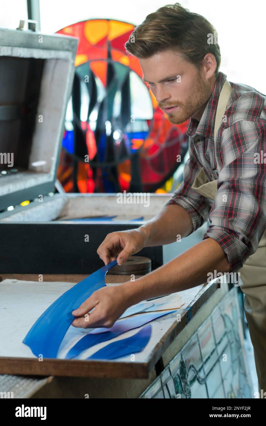 man working on industrial injection molding press machine Stock Photo ...