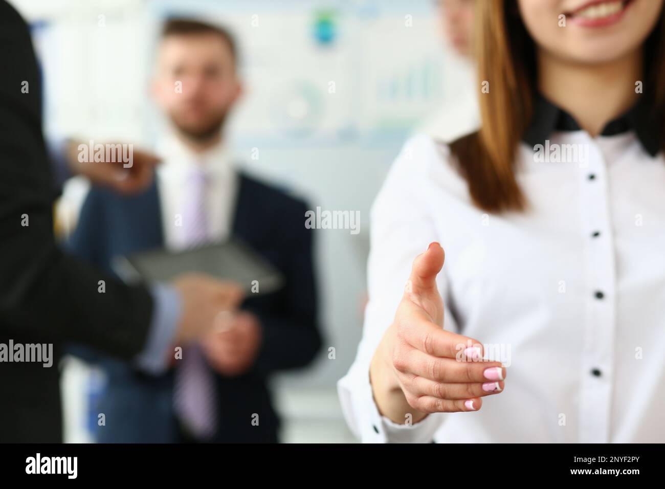 Portrait of a smiling business woman offering handshake Stock Photo - Alamy