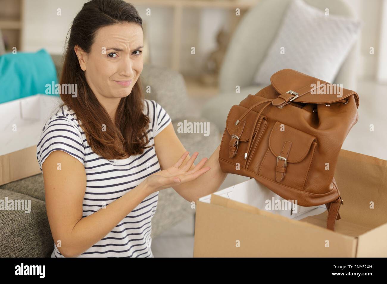 woman has received the wrong product in a delivery Stock Photo - Alamy
