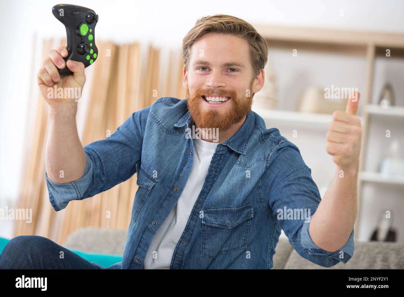 happy man playing video games Stock Photo - Alamy