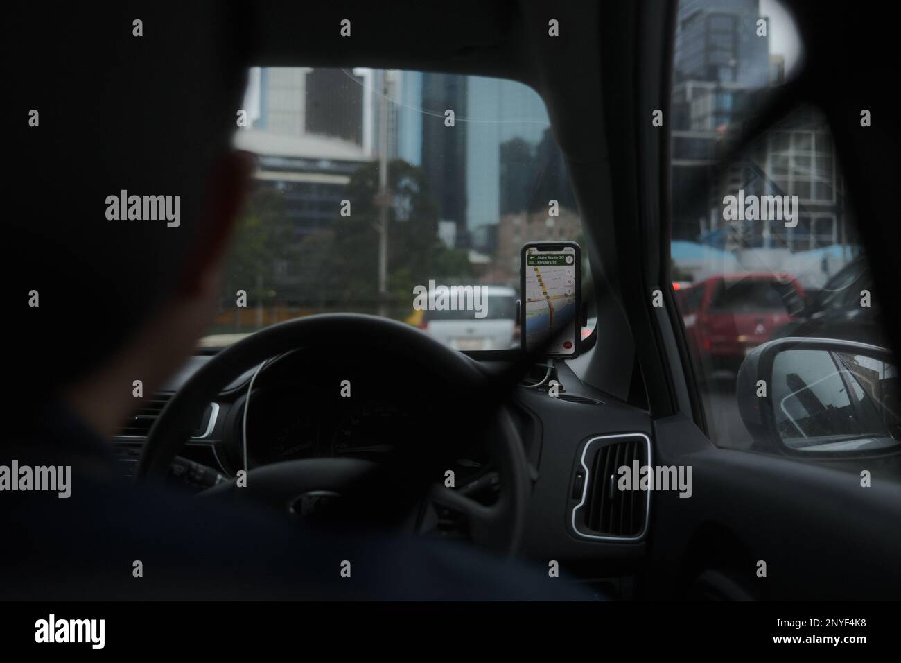 Uber driver on the road with phone GPS Stock Photo - Alamy