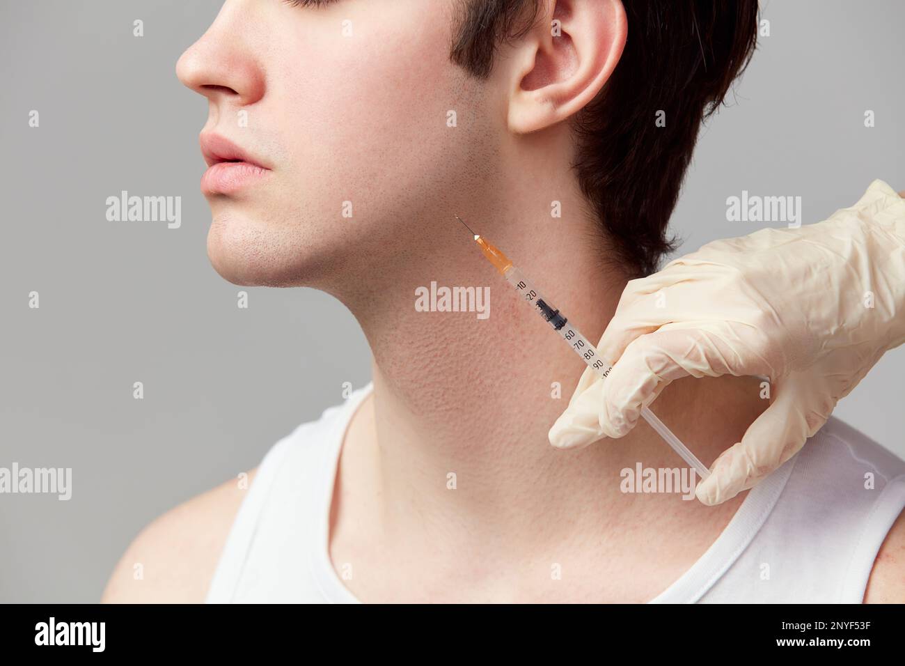 Chin fillers. Cropped image of young man doing cosmetological ...