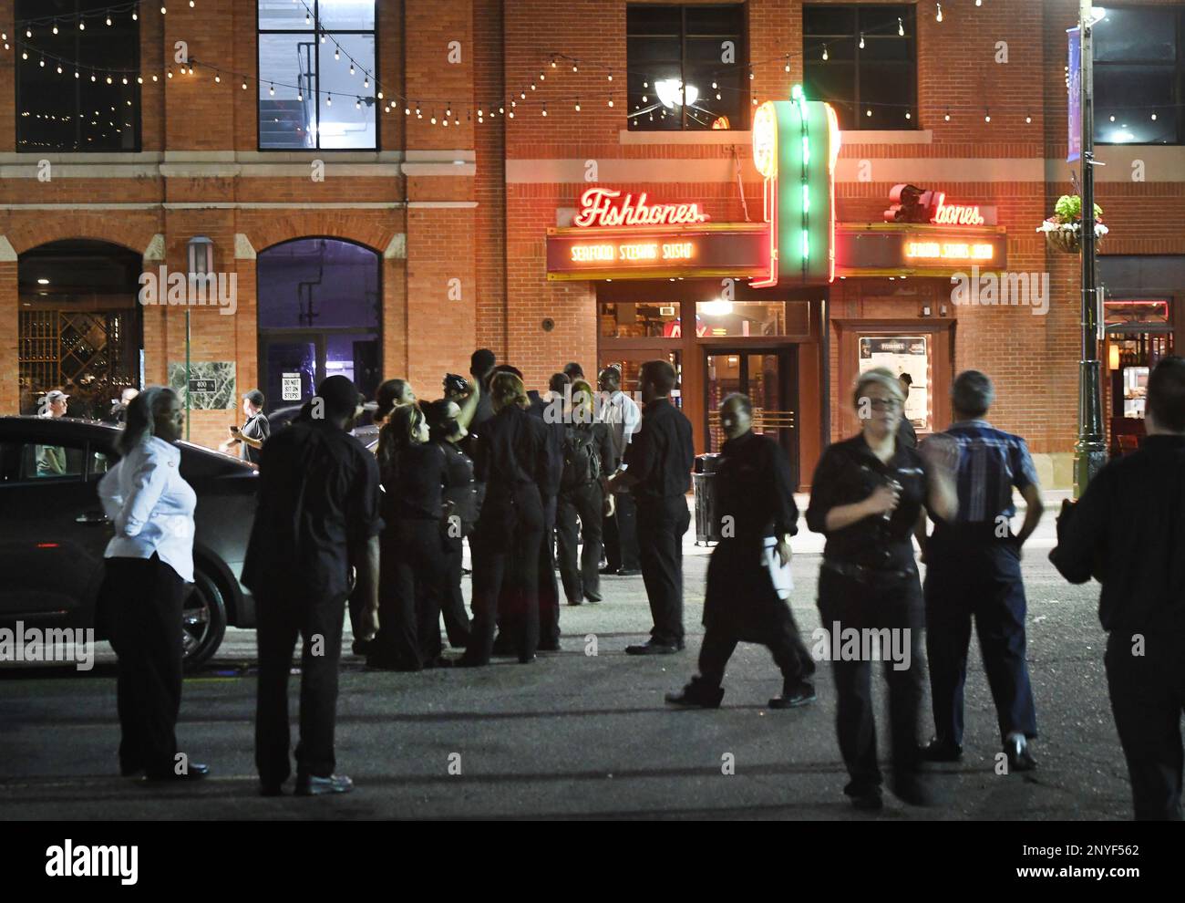 Fishbones employees wait across the street from the restaurant after an ...