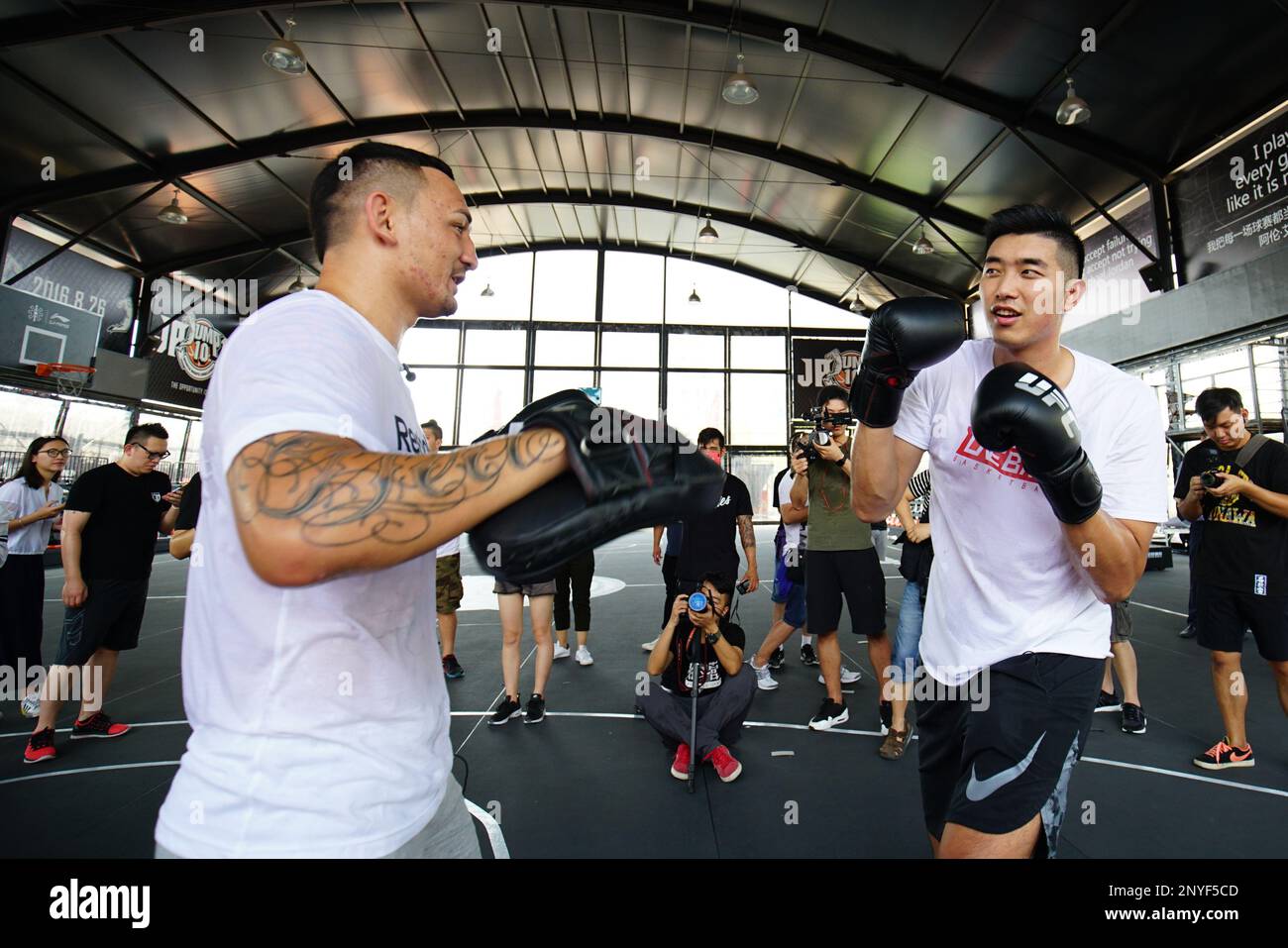 American mixed martial artist Max Holloway, left, the UFC Featherweight ...