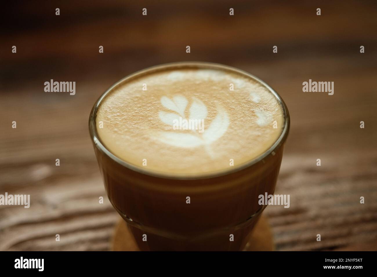 A cup of latte with beautiful latte art Stock Photo - Alamy