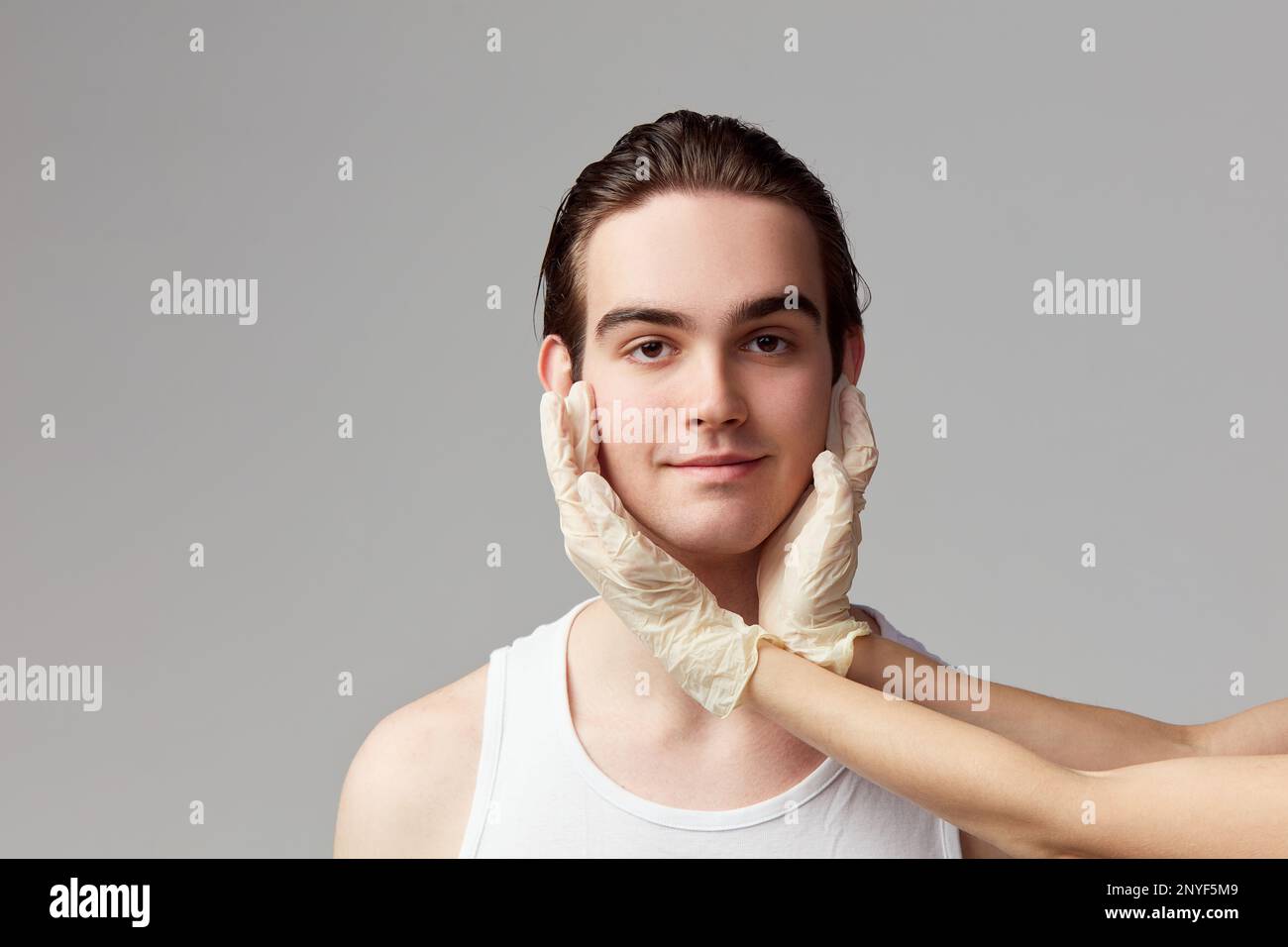 Cosmetology. Portrait of young man with well-kept skin. Male model ...
