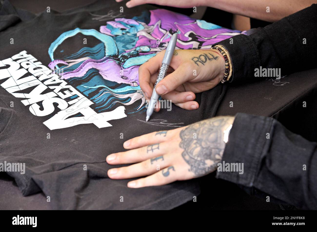 Danny Worsnop of Asking Alexandria signs autographs during the Mayhem ...