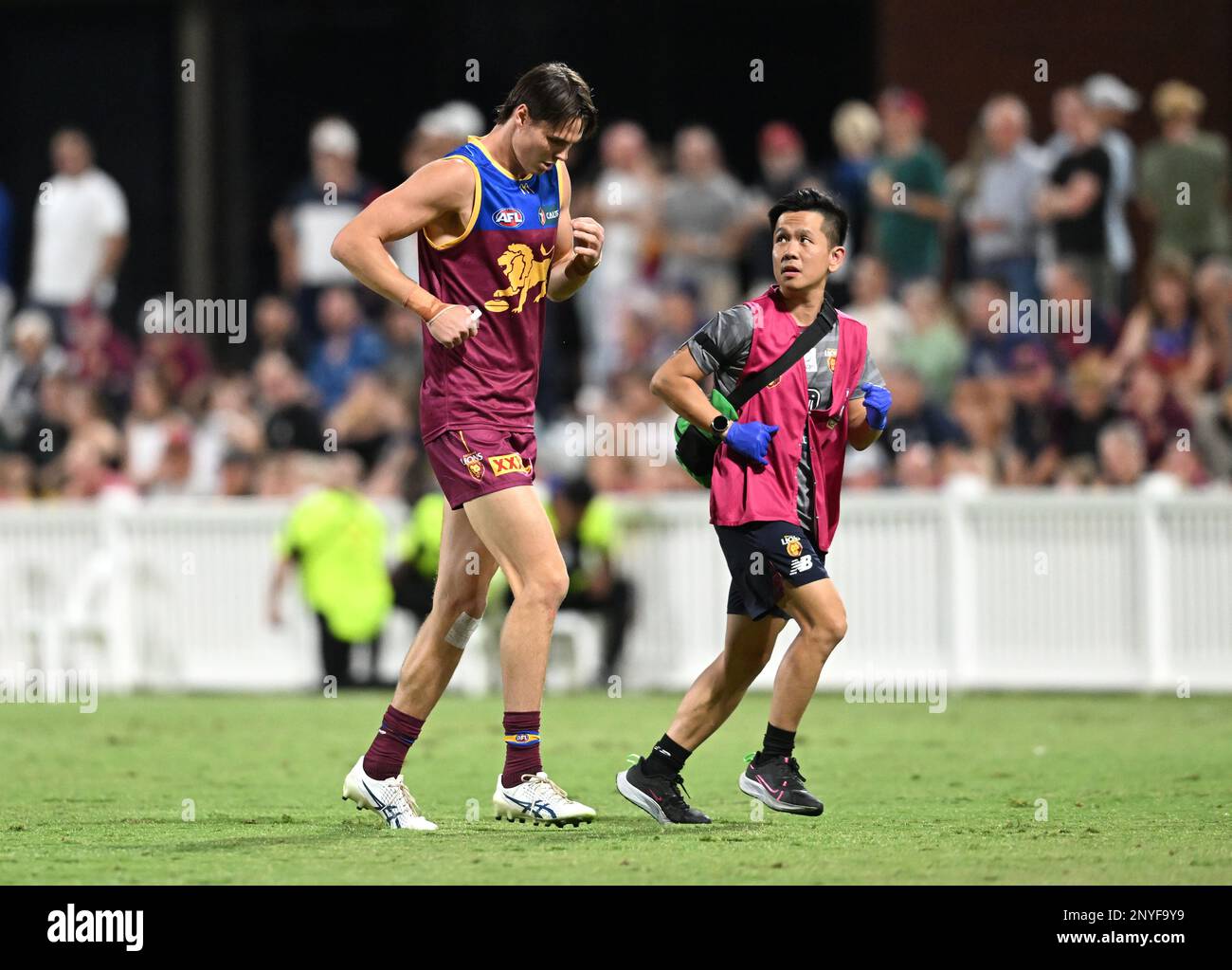 Eric Hipwood of the Lions is seen leaving the field with an injury ...