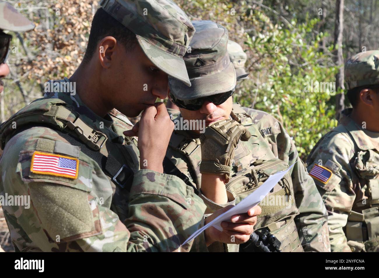 3rd Infantry Division Soldiers review their land navigation coordinates ...