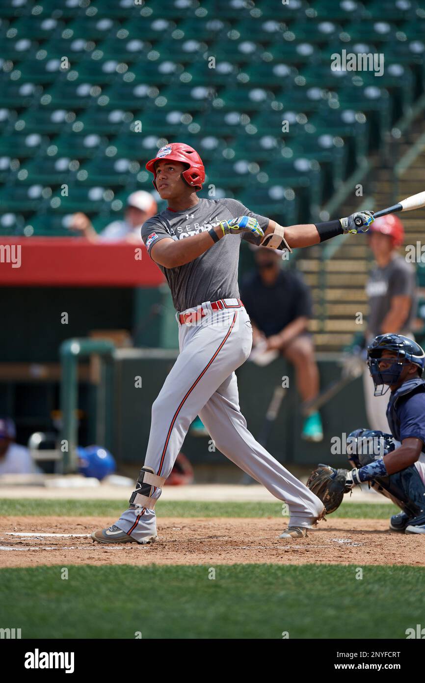 Bayron Lora (15) hits a home run during the Dominican Prospect League ...