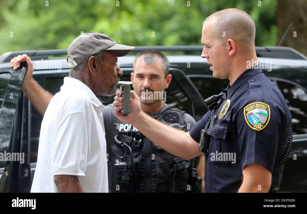Rocky Mount Police Officer E.J. Rauen, right, administers a breath test ...