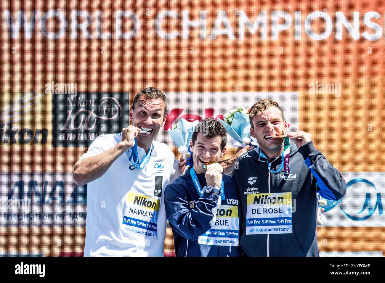 Michal Navratil (L) of the Czech Republic, Steven LoBue (C) of the USA ...