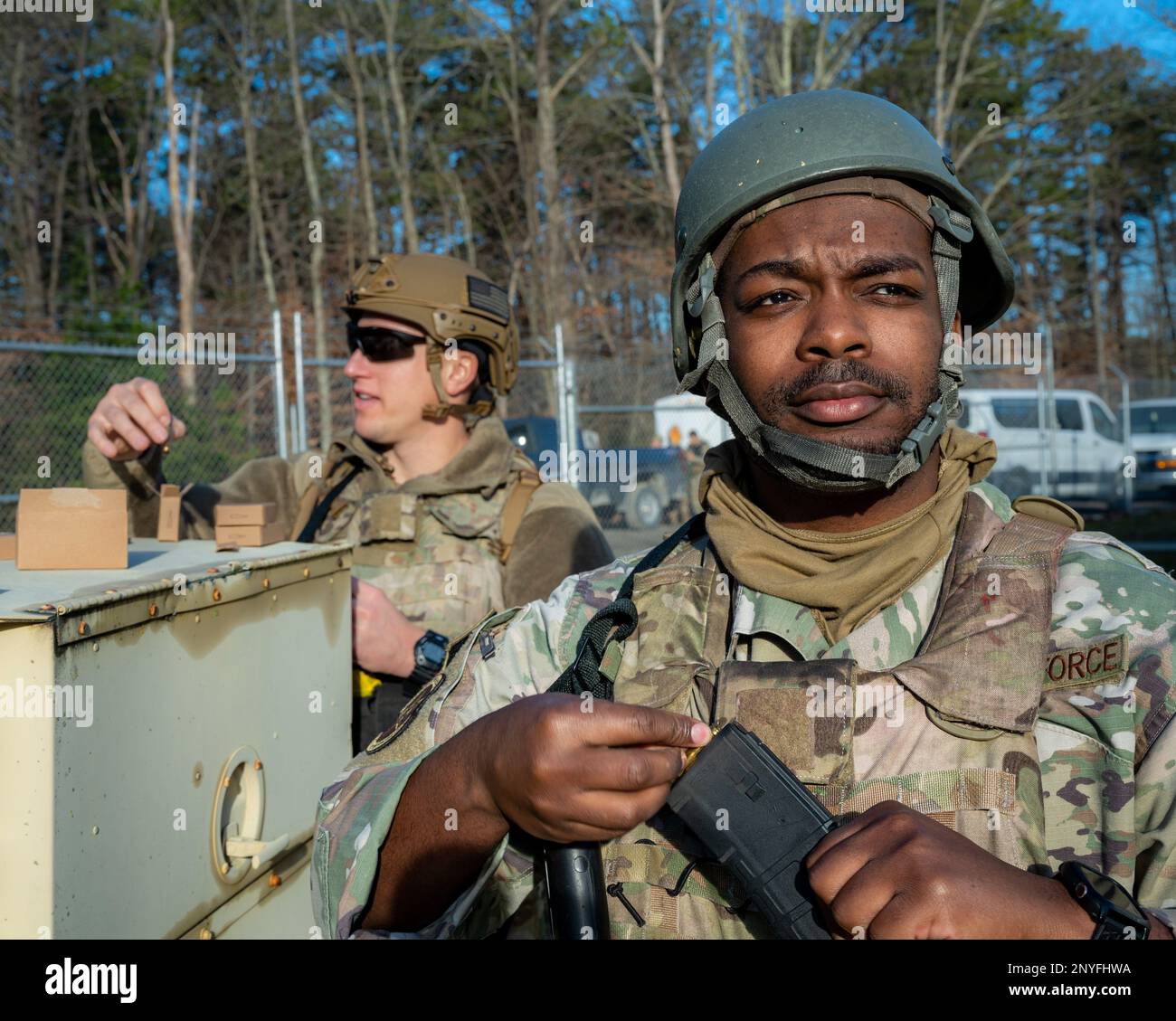 U.S. Air Force Maj. Joshua Tarkalson (left) and U.S. Air Force Staff ...