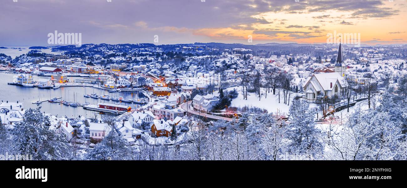 From above panorama of town with houses and towers located on hill ...