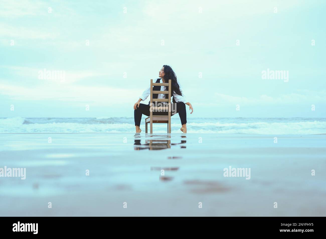 From below full length of peaceful young female in black and white ...