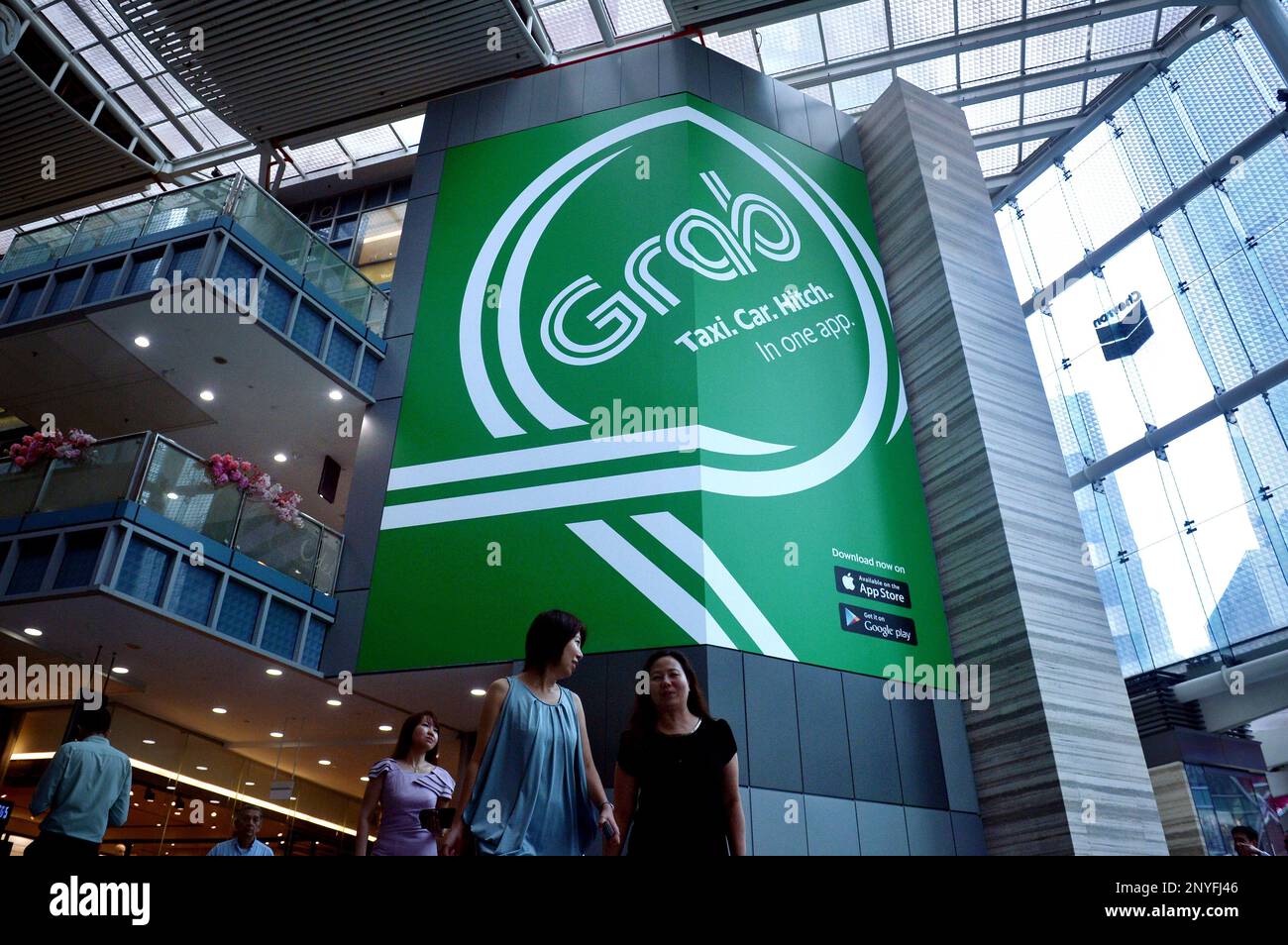 A "Grab" taxi banner on display in Change Alley at Raffles Place in the ...