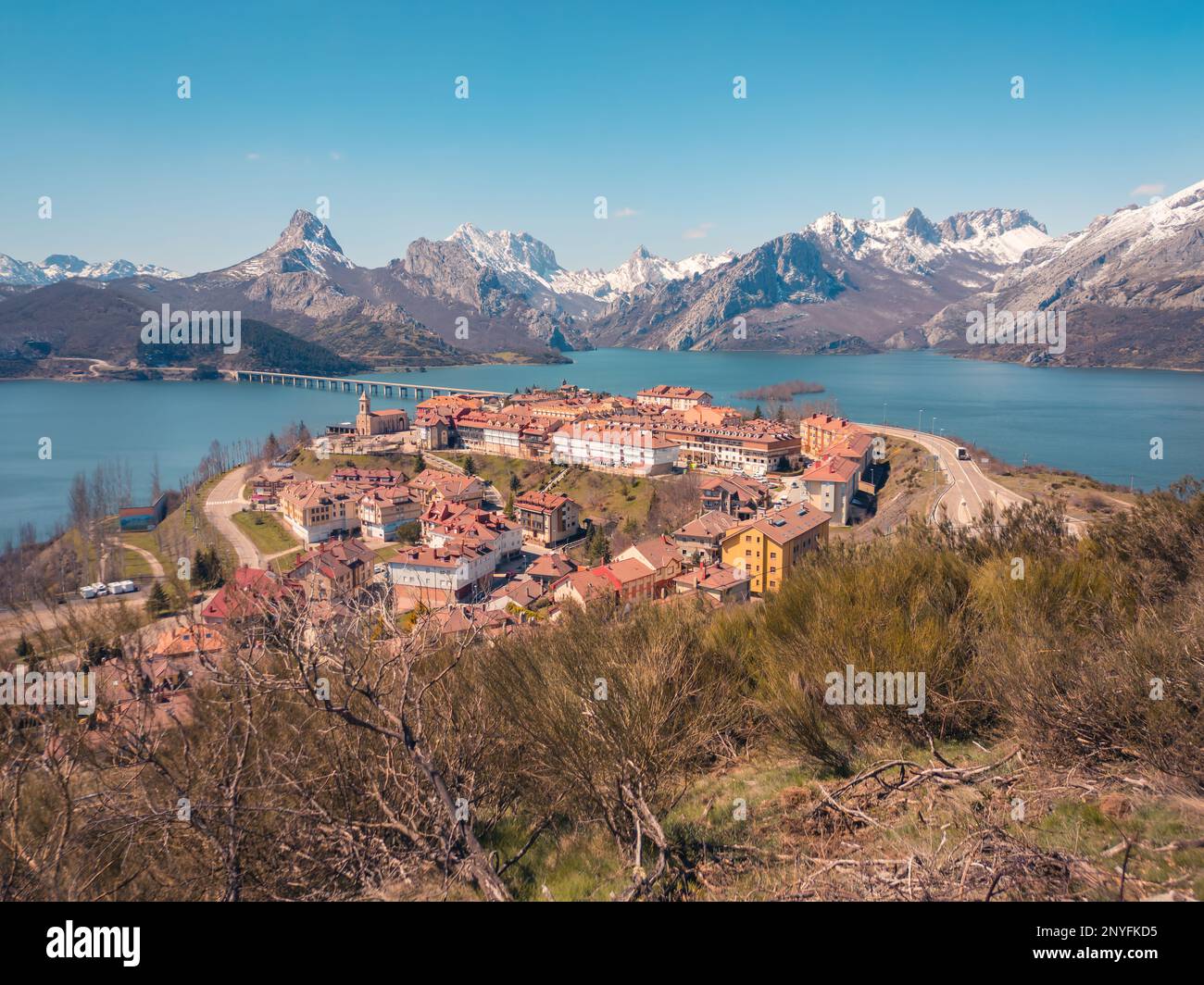 Picturesque view of small town located on shore of calm blue sea with ...