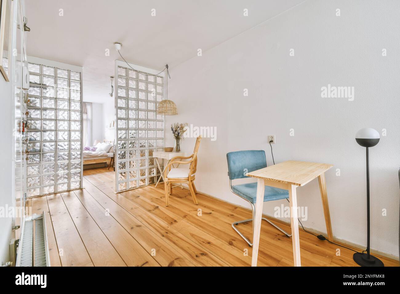 Interior design of wide white wall passage with glass door and wooden ...