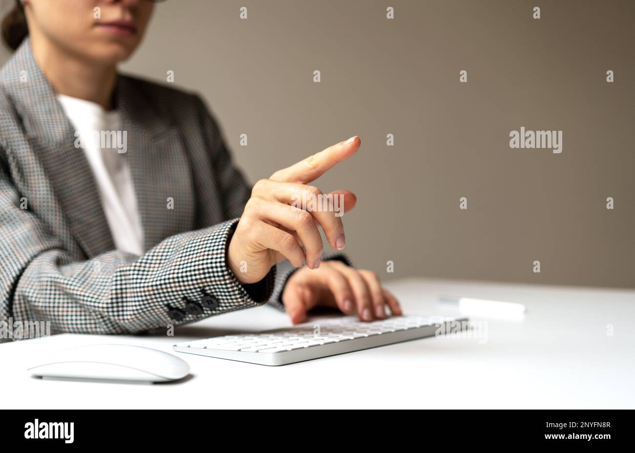 Woman person sitting at the desk working on computer touching virtual ...