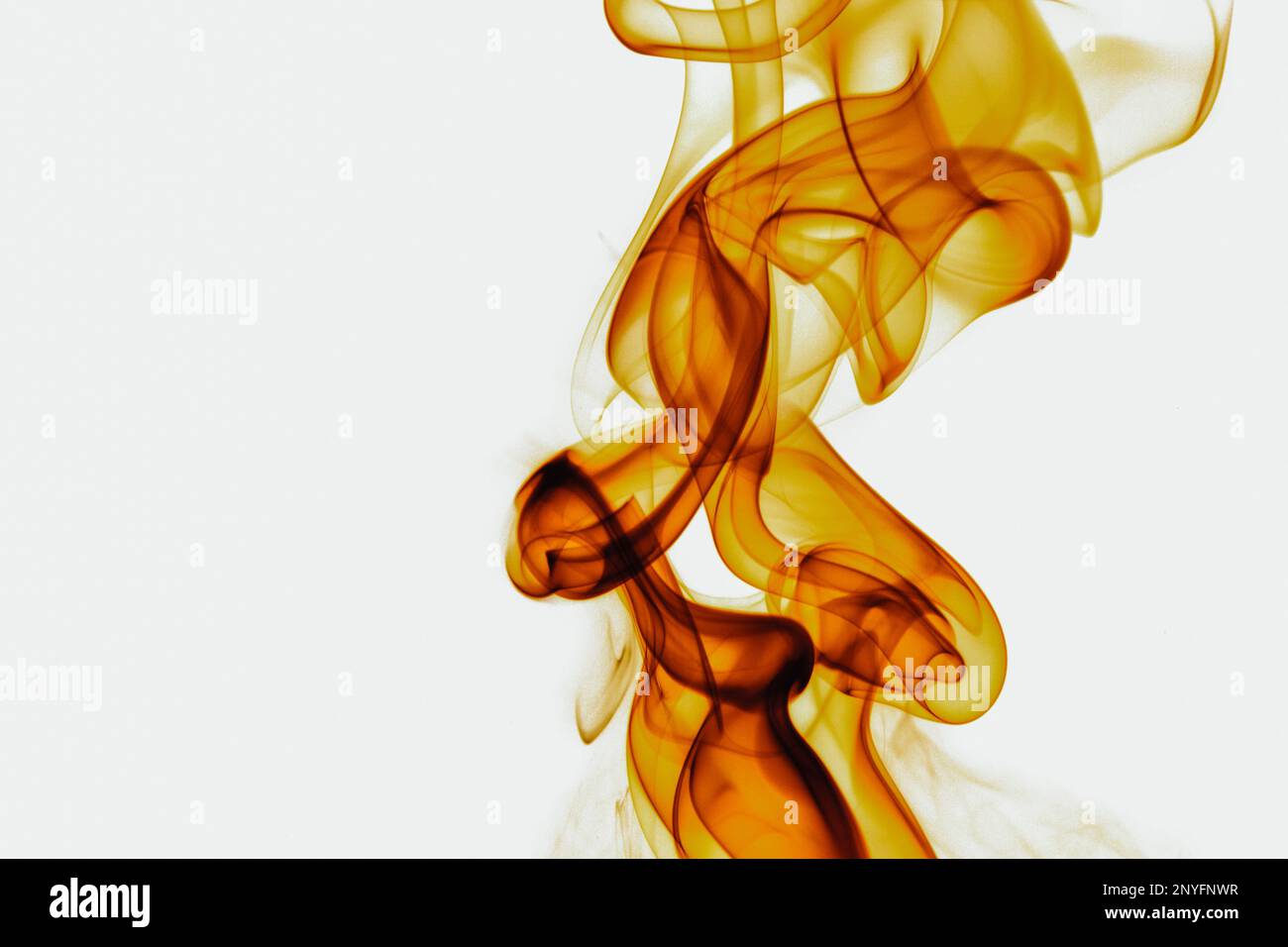 Abstract backdrop with stains of orange incense smoke Stock Photo - Alamy