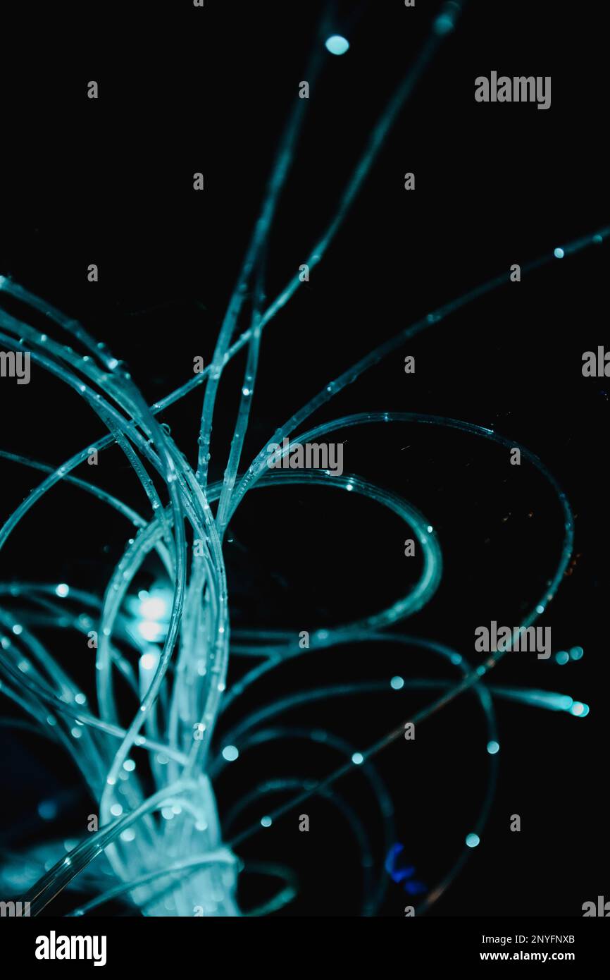 Closeup of abstract blue translucent thin wire with illumination inside ...