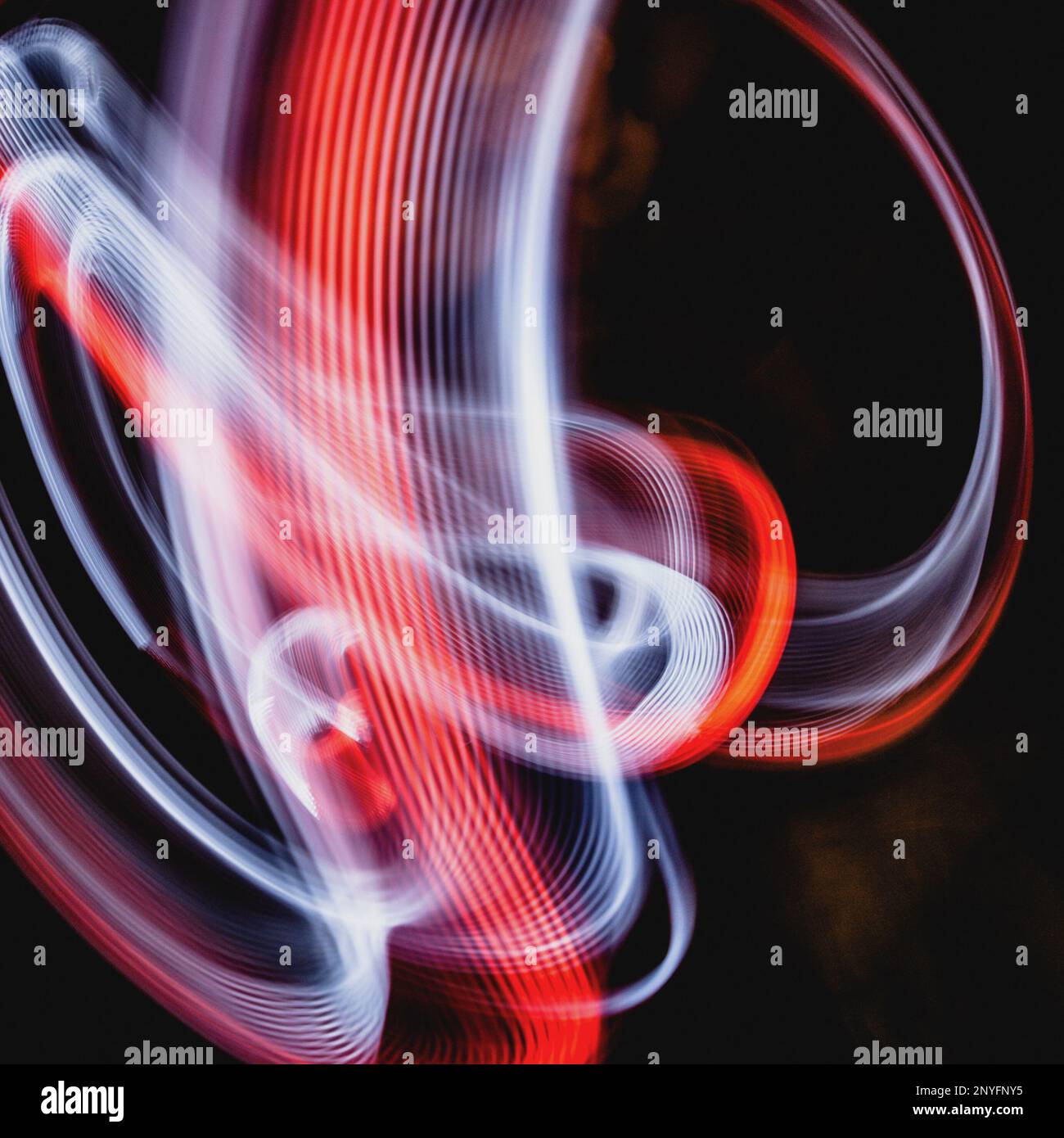 Abstract background with diffused tracks of bright red and white rays ...