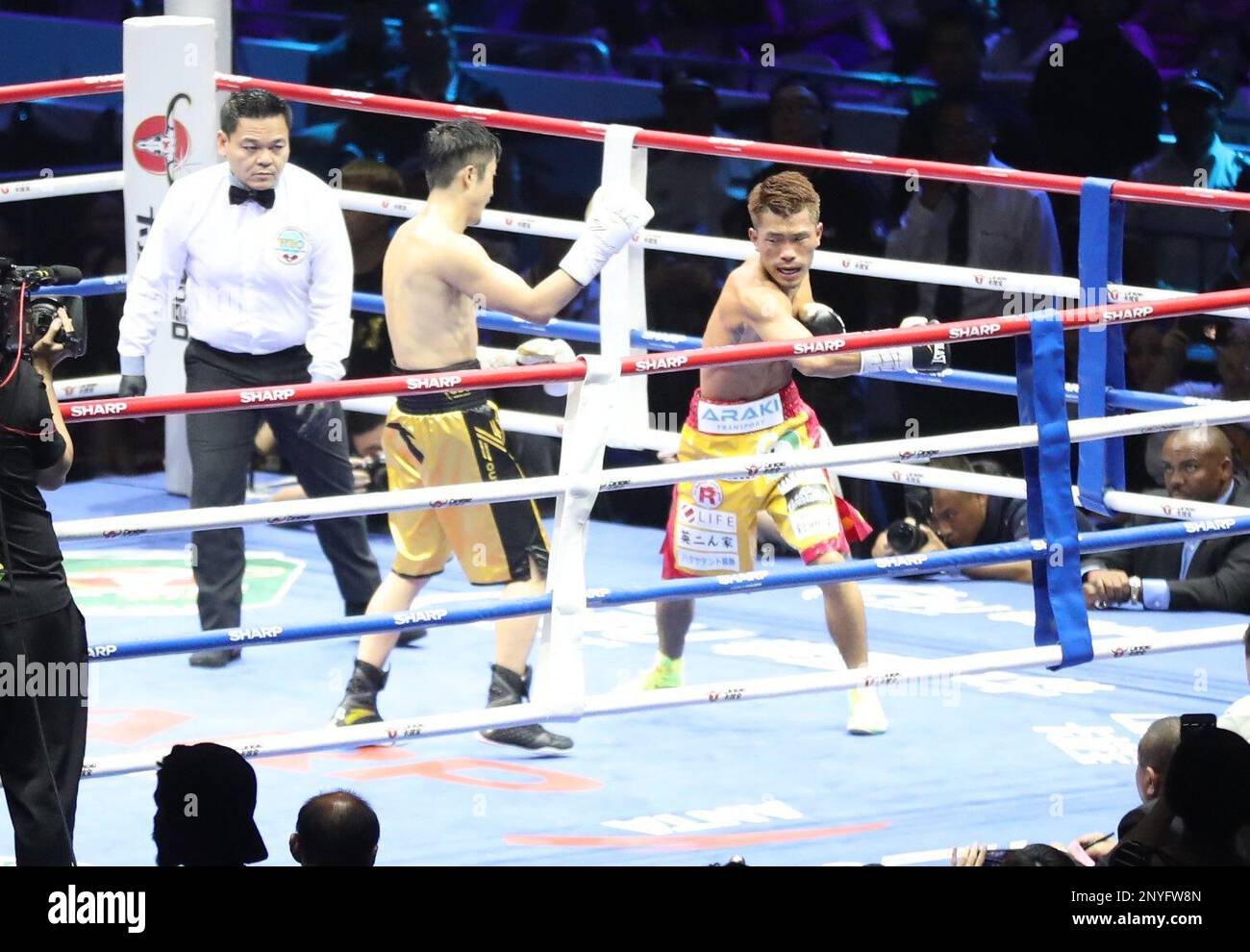 Japanese boxer Sho Kimura, right, hits Chinese boxer Zou Shiming ...