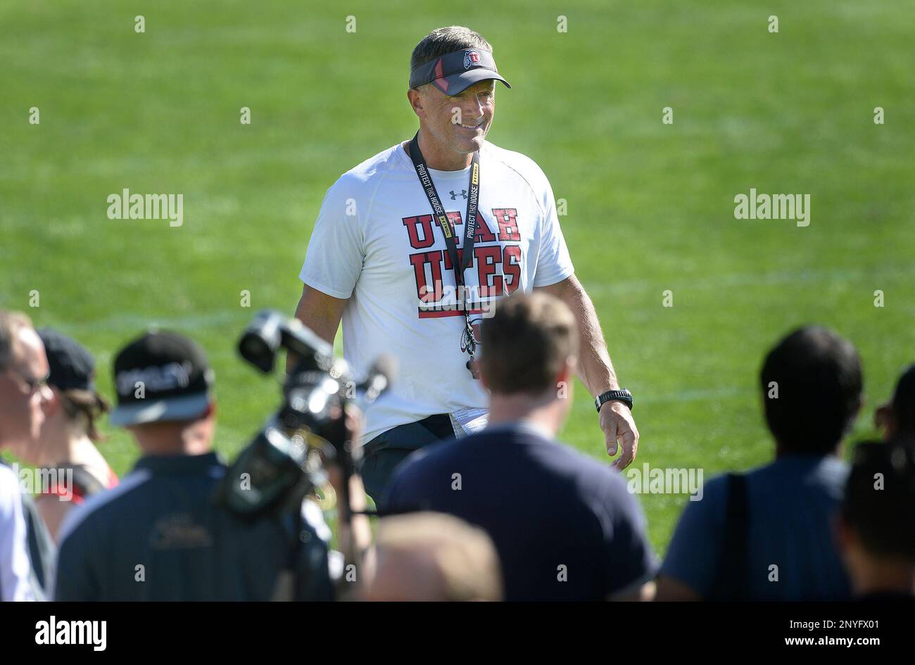 Utah head coach Kyle Whittingham heads toward a group of reporters ...