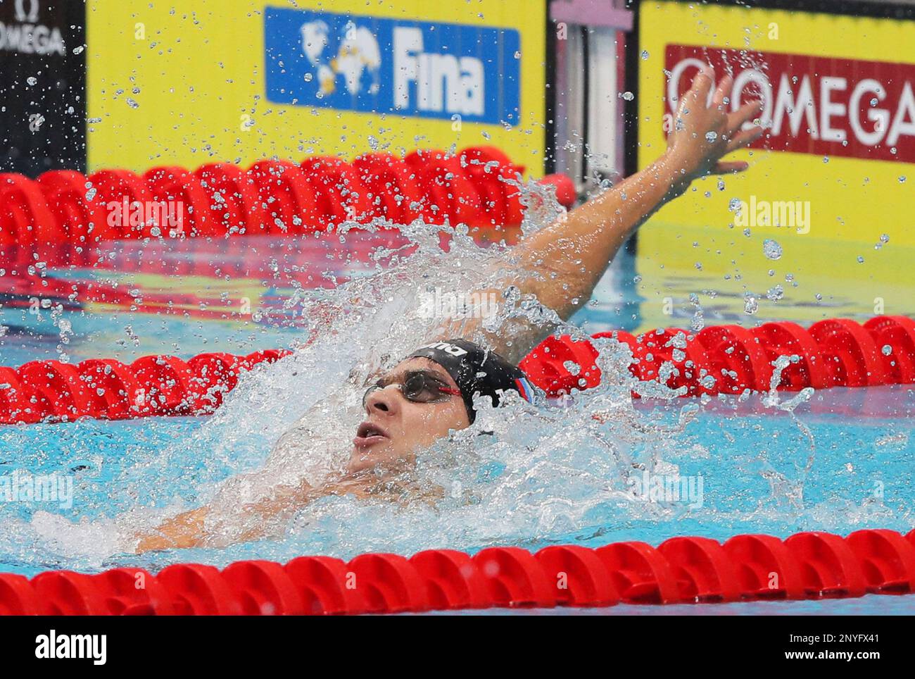 Russian swimer Evgeny Rylov competes in the men's 200m backstroke final ...