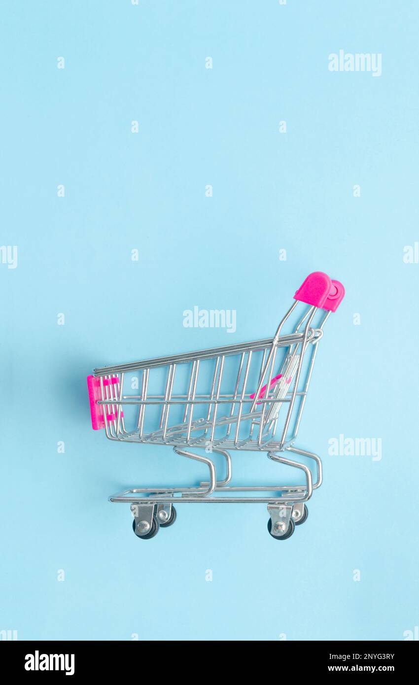Shopping concept cart on blue hi-res stock photography and images - Alamy
