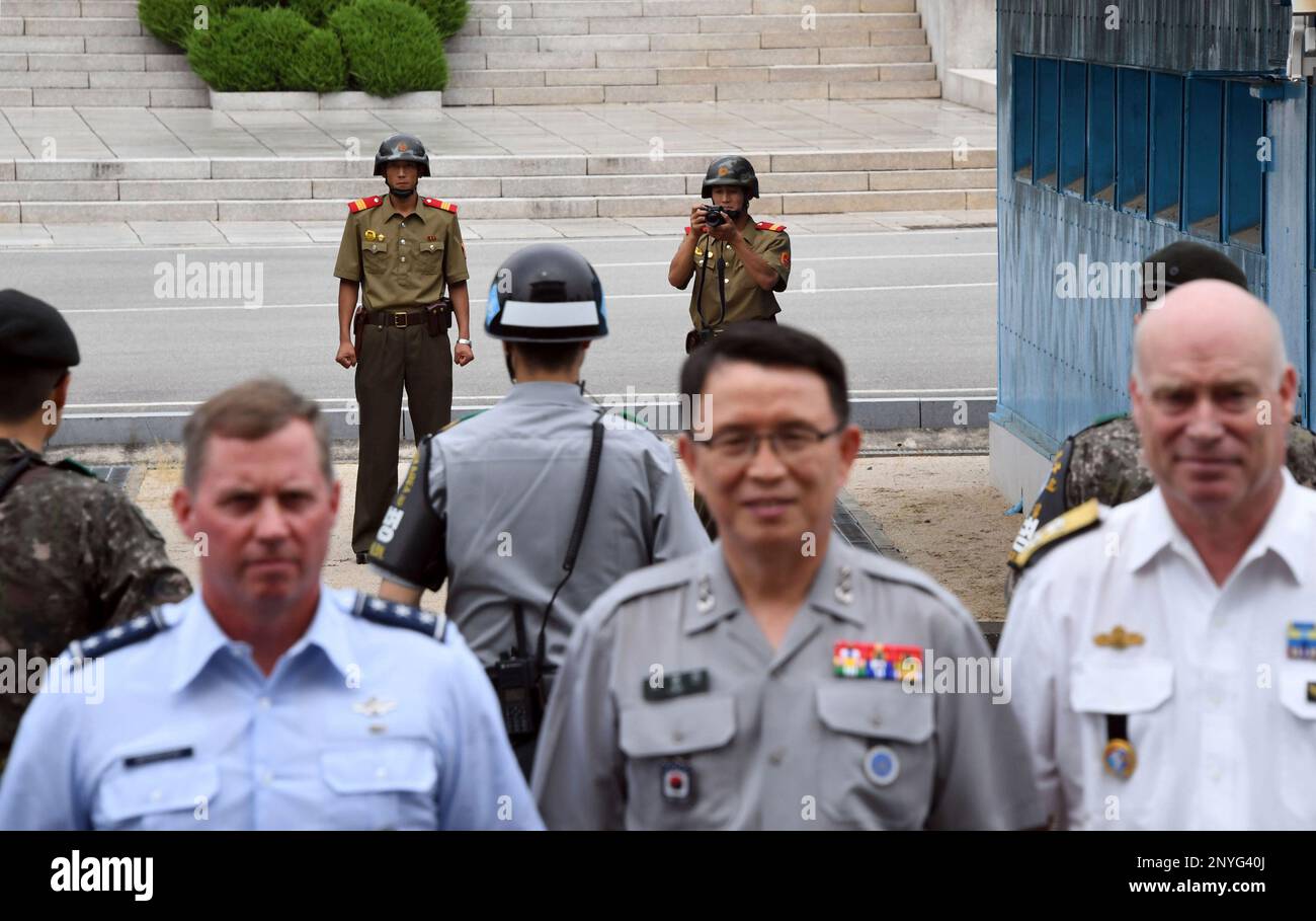 North Korean soldiers, rear, watch the south side as Deputy Commander ...