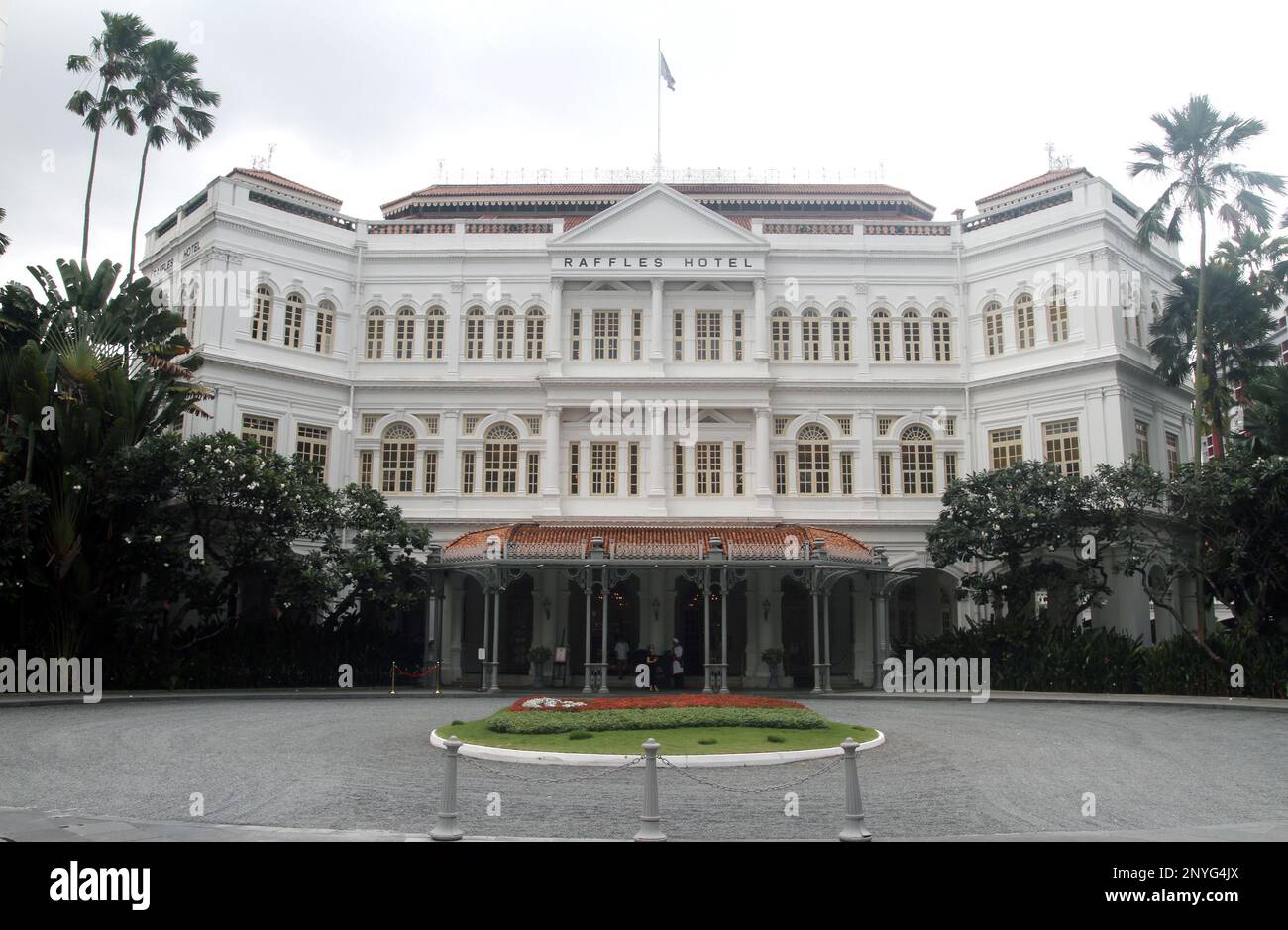 The exterior of Raffles Hotel is kept pristine white all year round ...