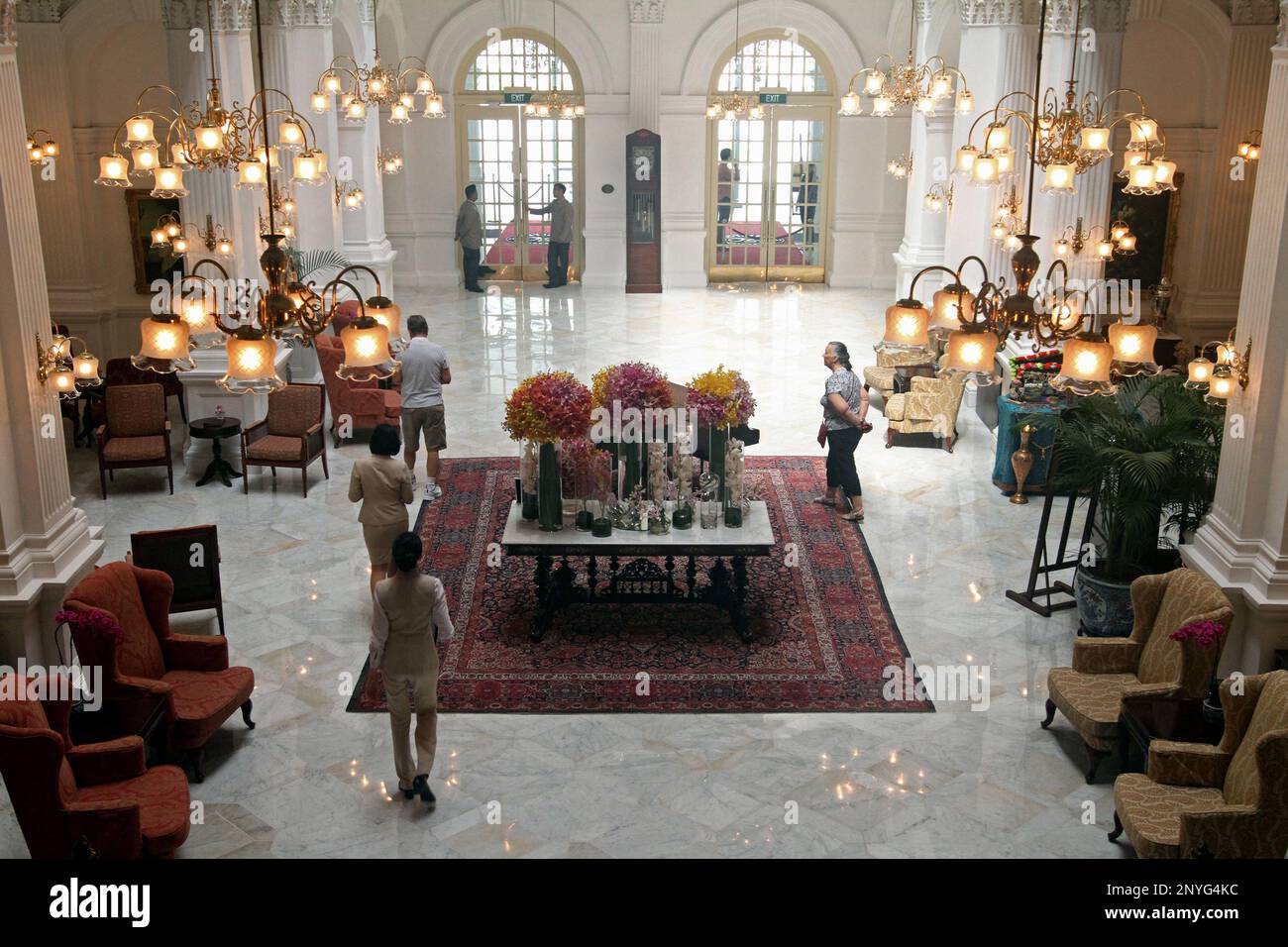 The lobby of the Raffles Hotel has a lot of antique pieces and ...