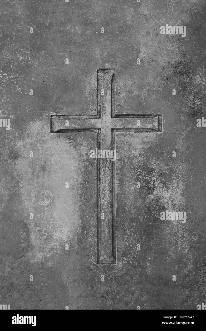 A simple typical cross embossed on a copper metal wall in a black and ...
